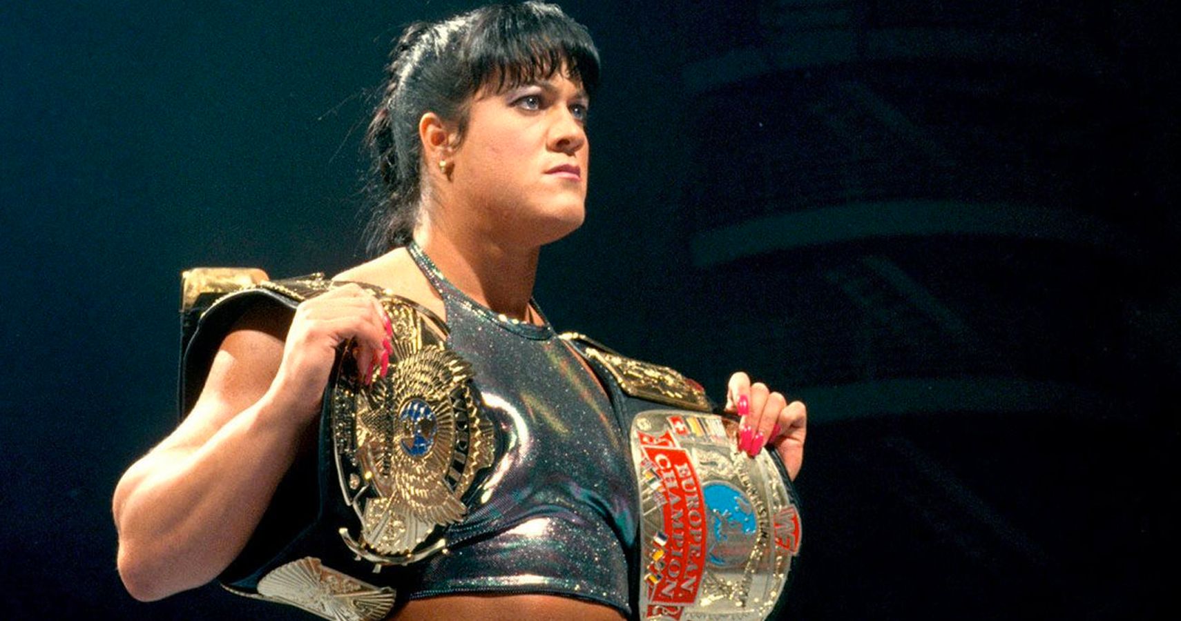 Show me a picture of a challenger holding a championship belt/design ...